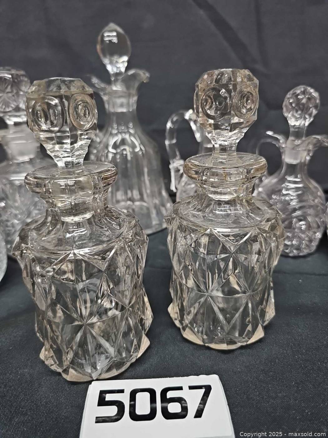 Group of pressed and cut glass cruets | Maxsold