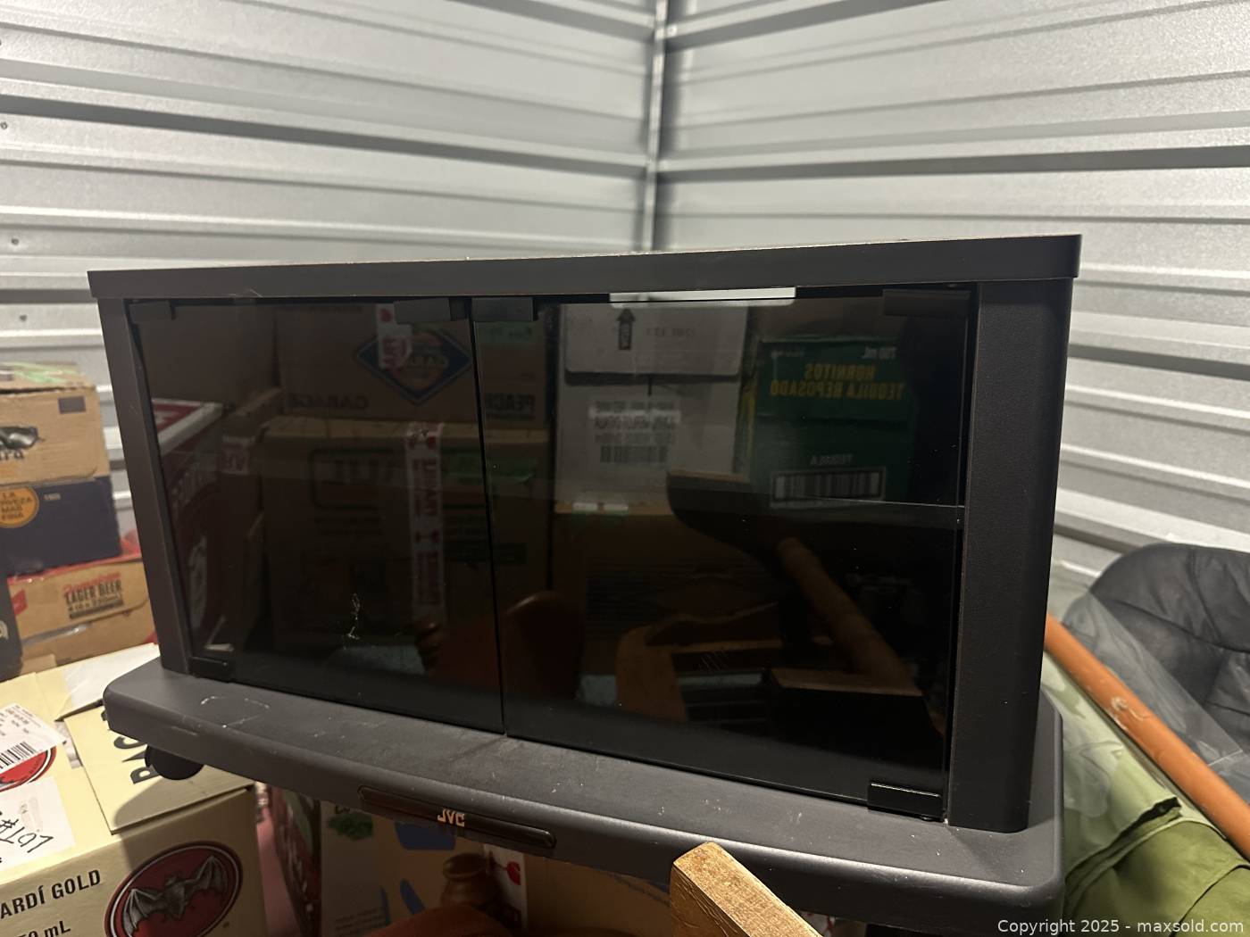 Black JVC TV cabinet with glass doors | Maxsold