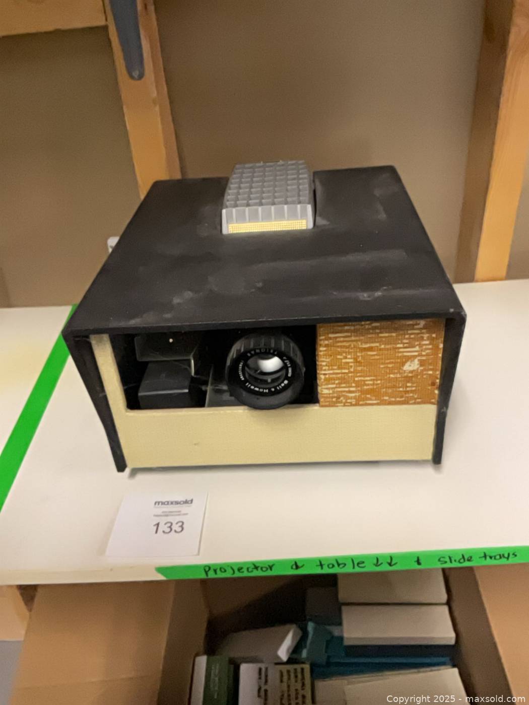 Vintage 35mm slide projector, table and slide trays | Maxsold