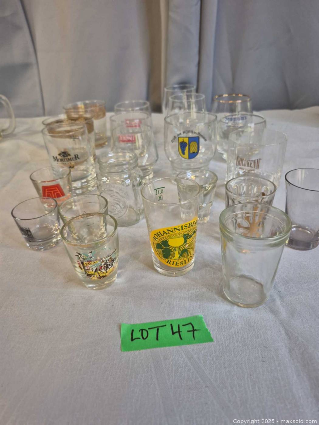 Assorted branded bar and shot glasses | Maxsold