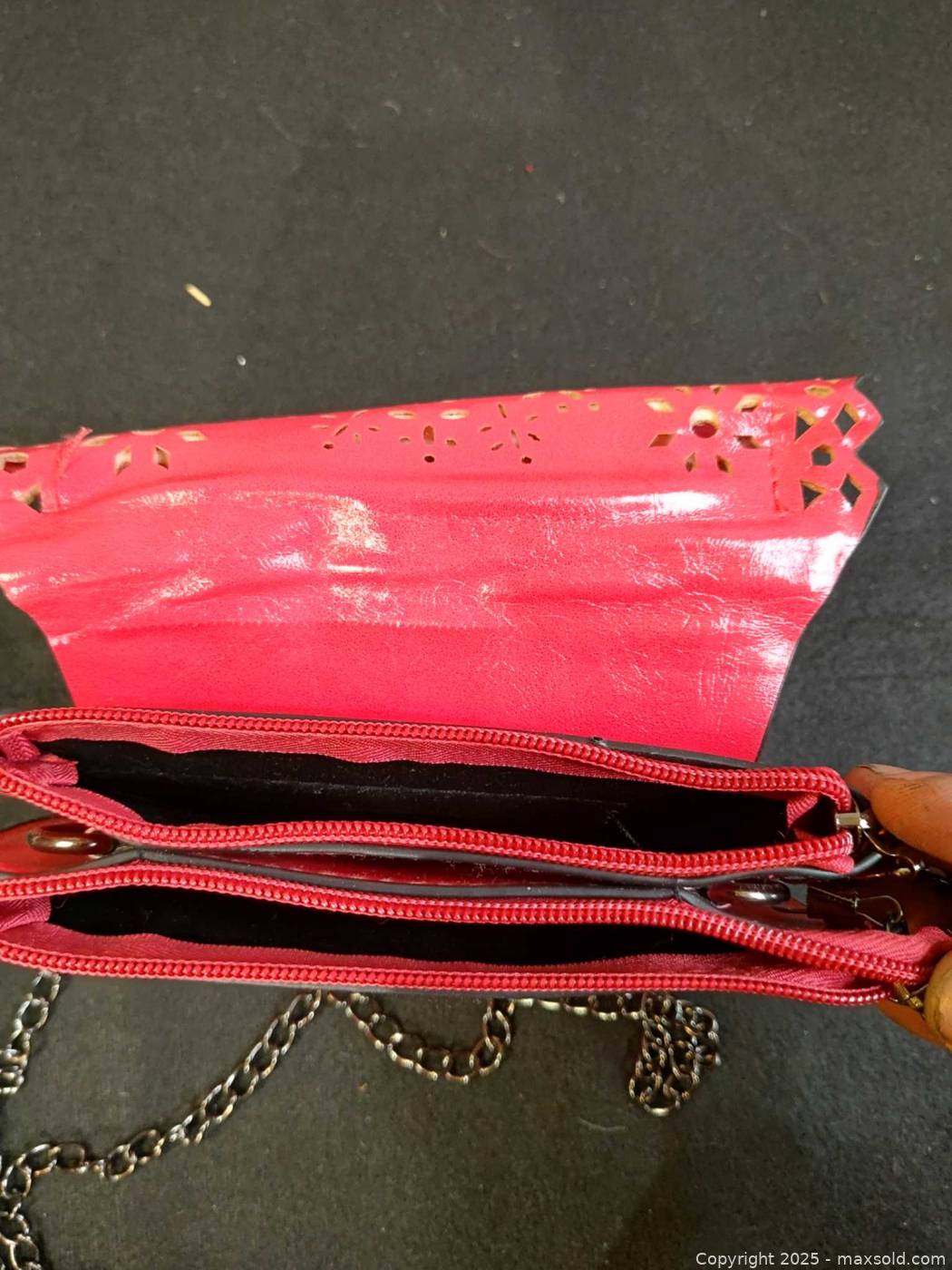 Red faux leather laser-cut purse with chain | Maxsold