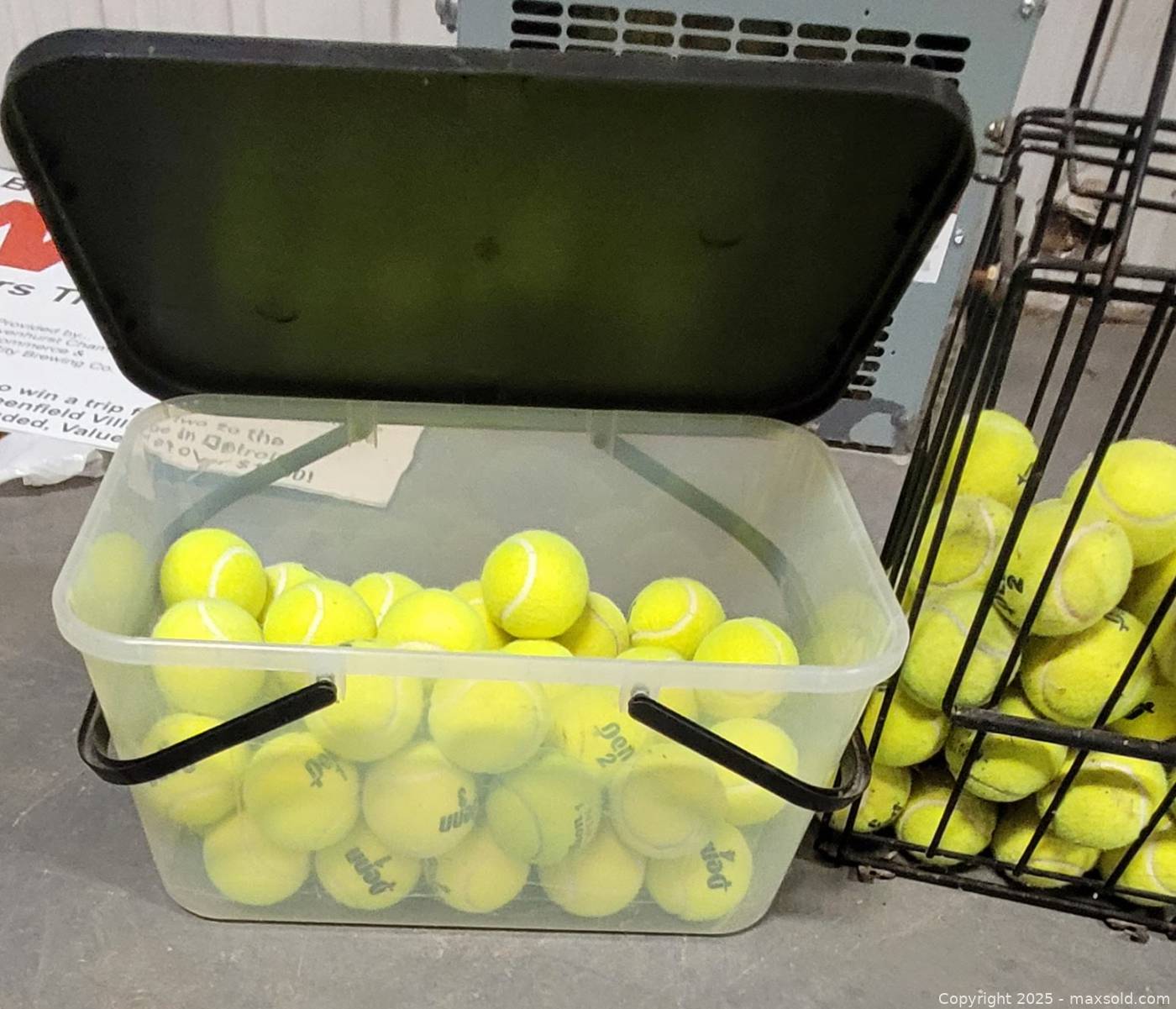 Tennis balls with plastic bin and wire basket | Maxsold