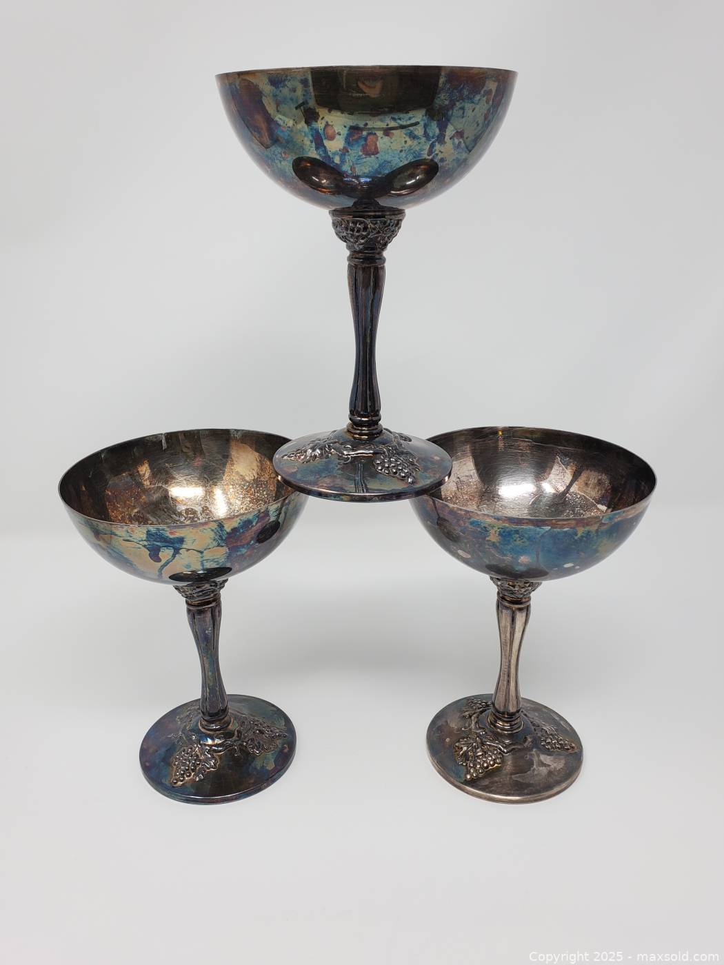 Three silver-plate grape-motif goblets | Maxsold