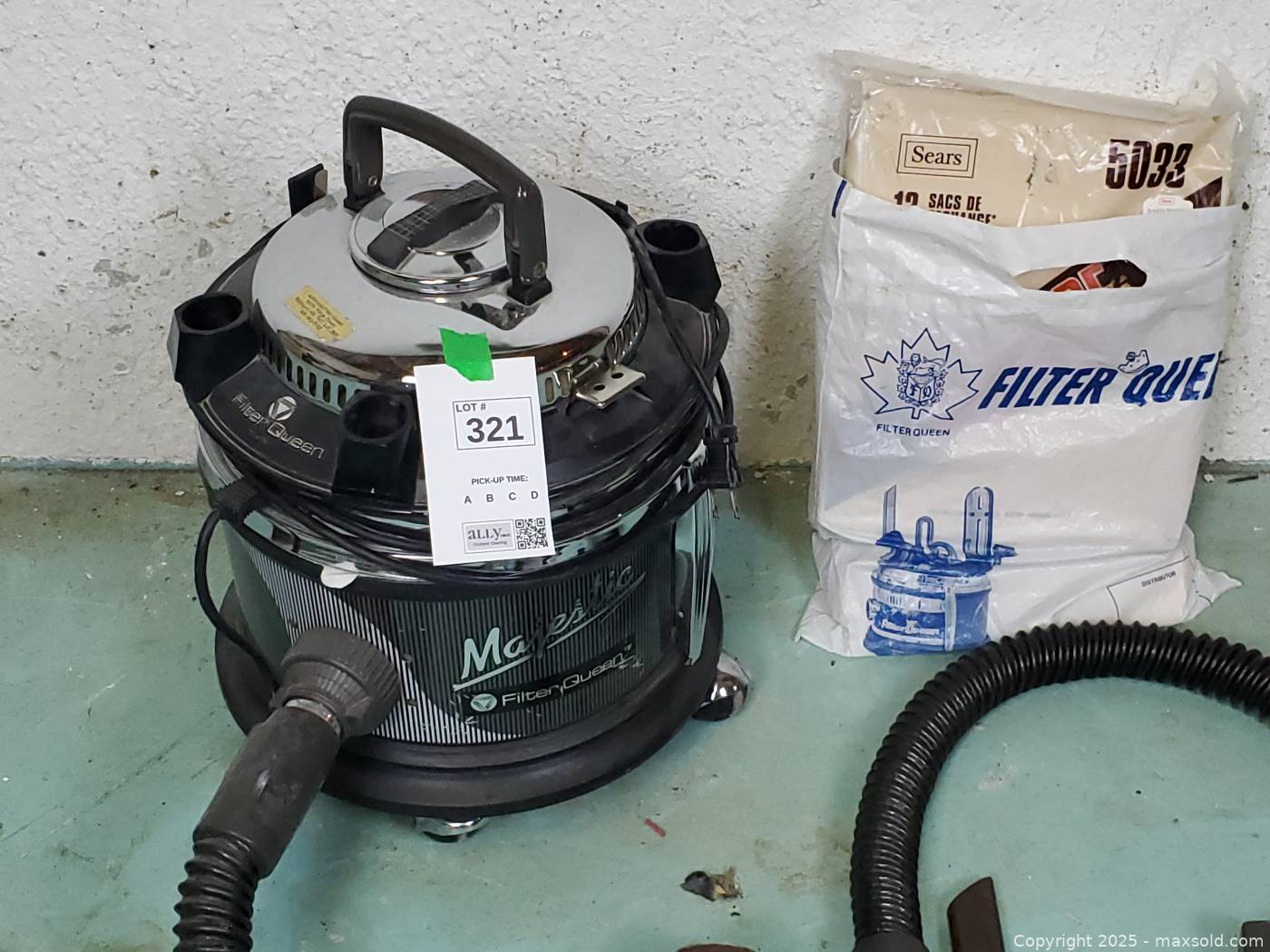 Filter Queen Majestic canister vacuum with hose and filter bags | Maxsold