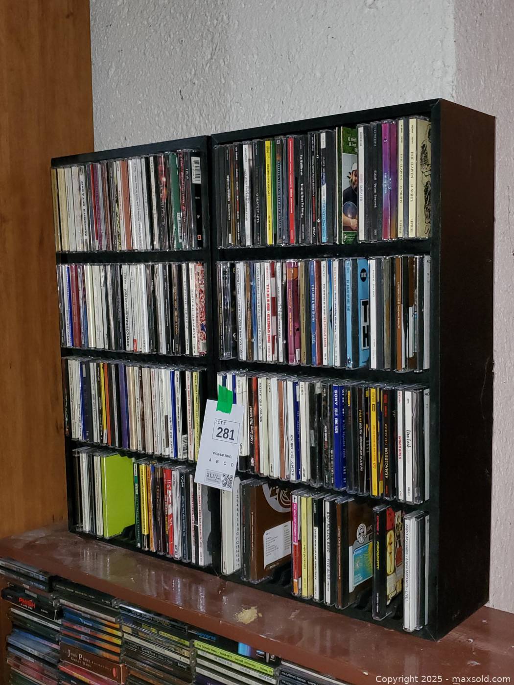 Black wooden CD holders with CDs | Maxsold