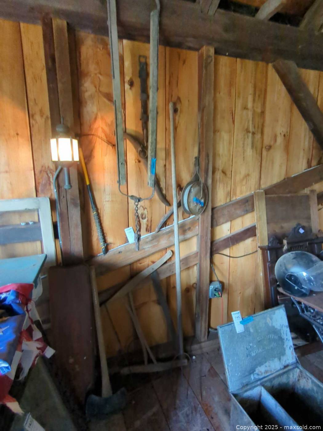Vintage saw, pitchfork, axe, yoke parts, pulley, chalk marker | Maxsold