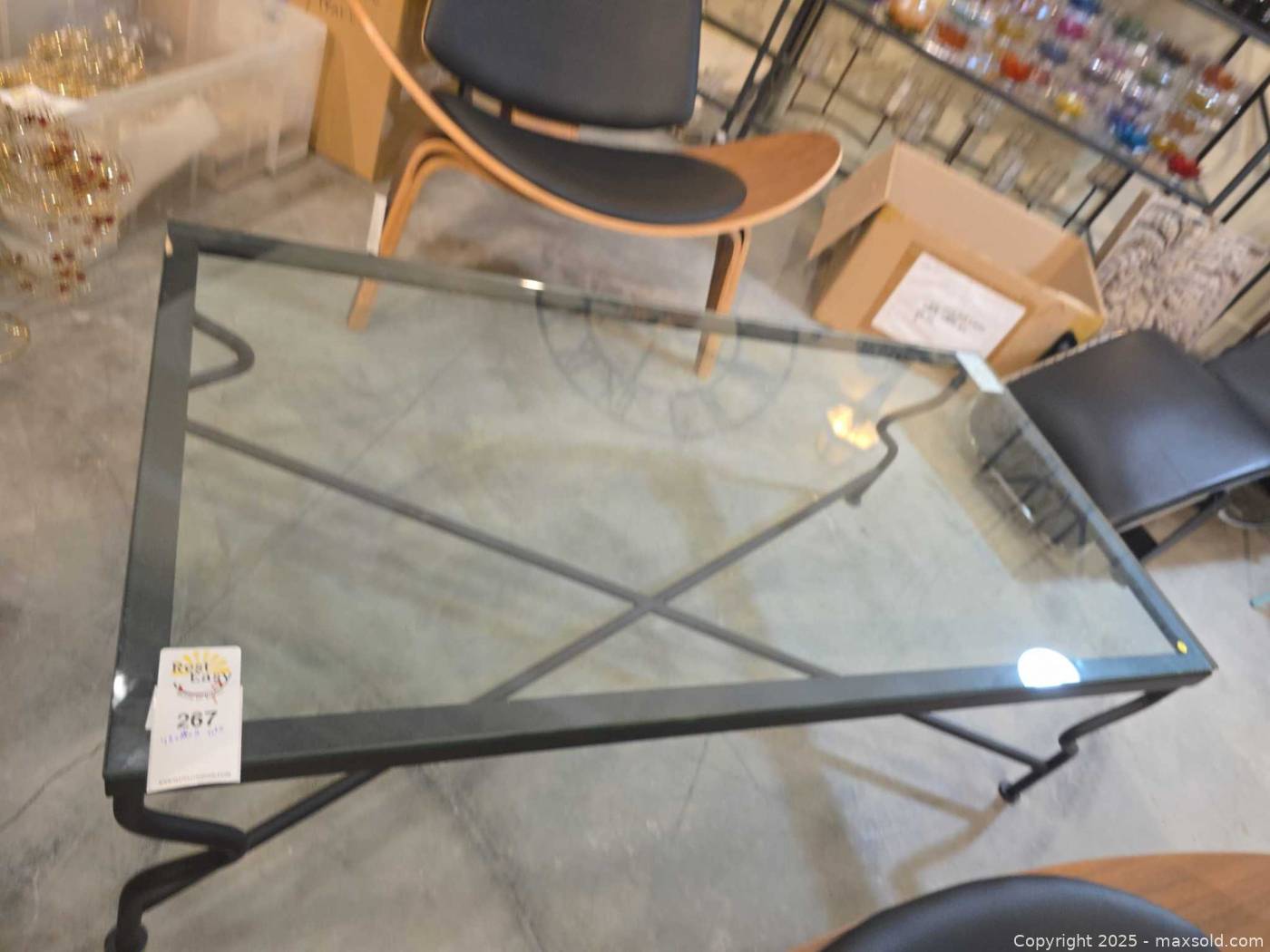 Iron and glass coffee table | Maxsold