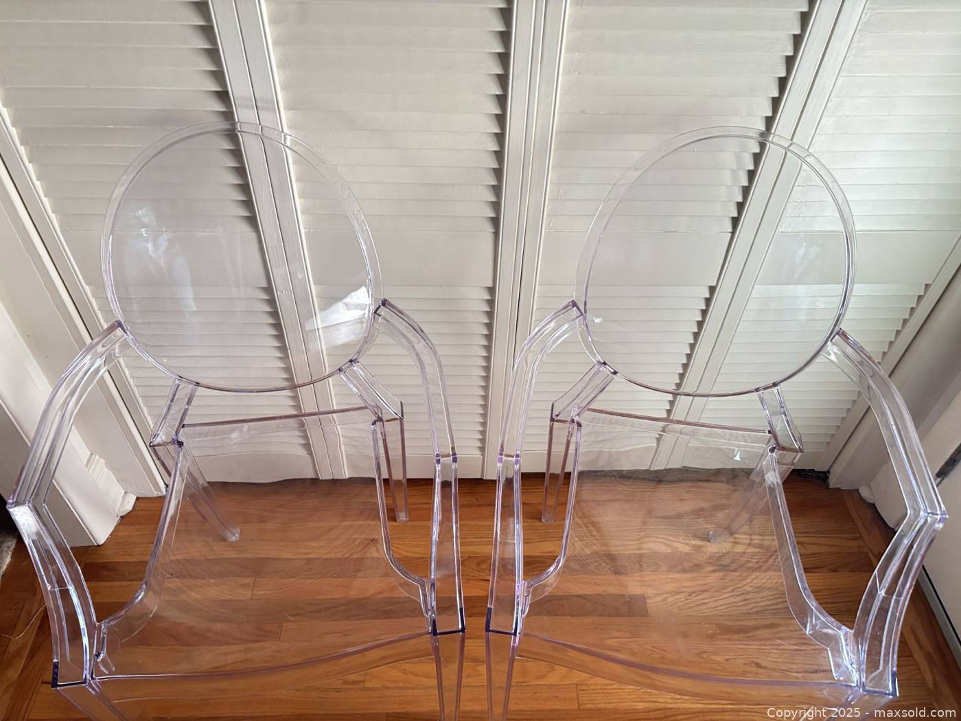 Pair clear acrylic ghost dining chairs | Maxsold