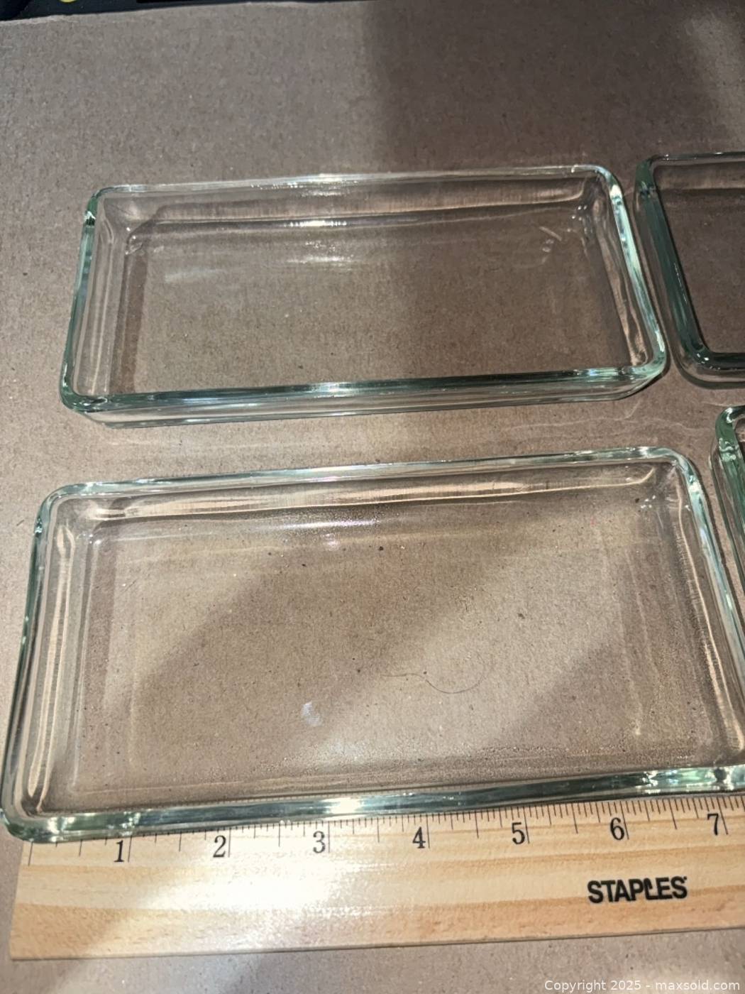 Pyrex glass loaf pan and four small glass trays | Maxsold