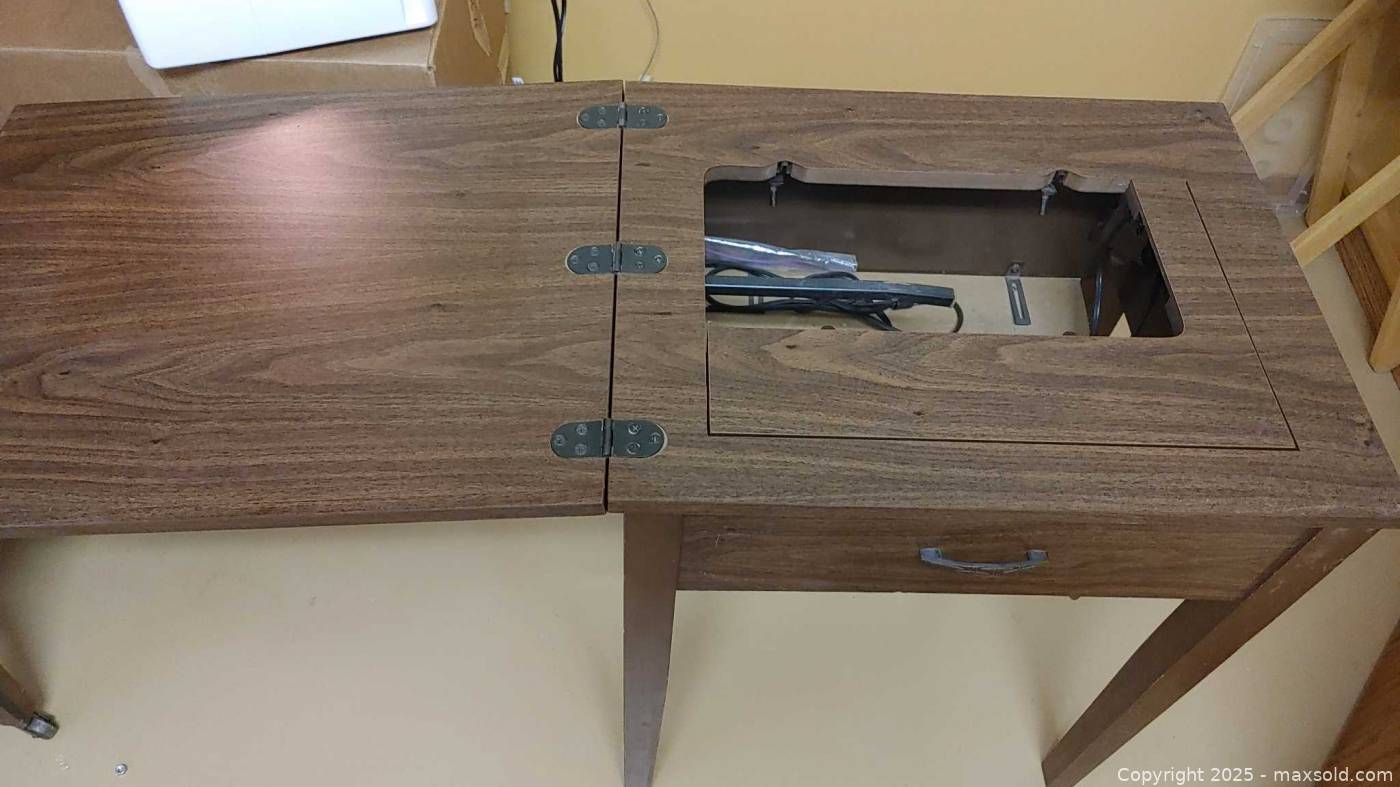 Vintage wood sewing cabinet with Brother Coverstitch machine and fabric ...
