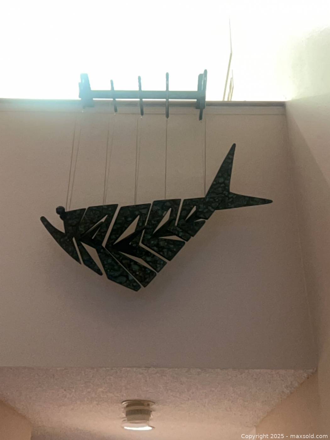 Green metal hanging fish sculpture | Maxsold