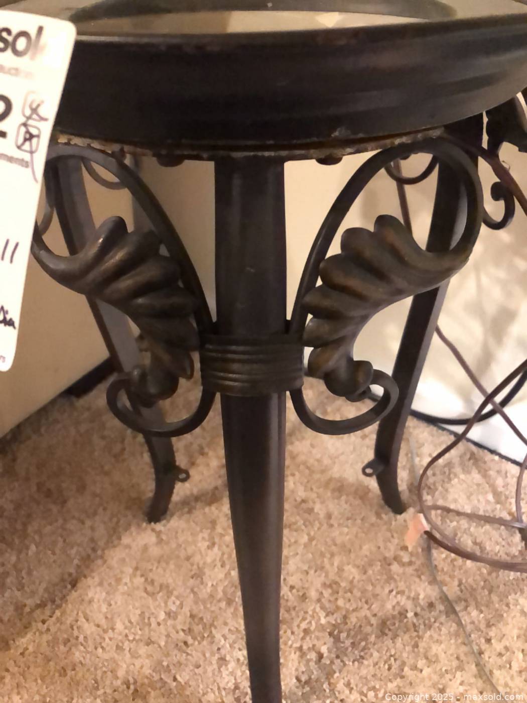 Round wrought iron and glass side table | Maxsold