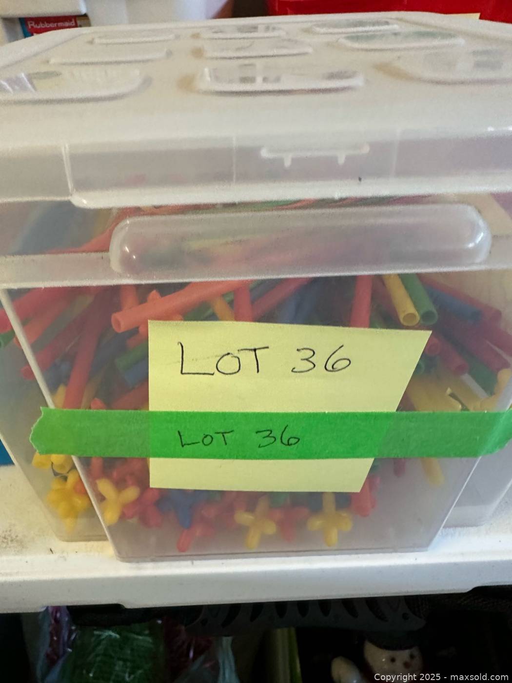 Assorted plastic building sticks and connectors with storage bin | Maxsold