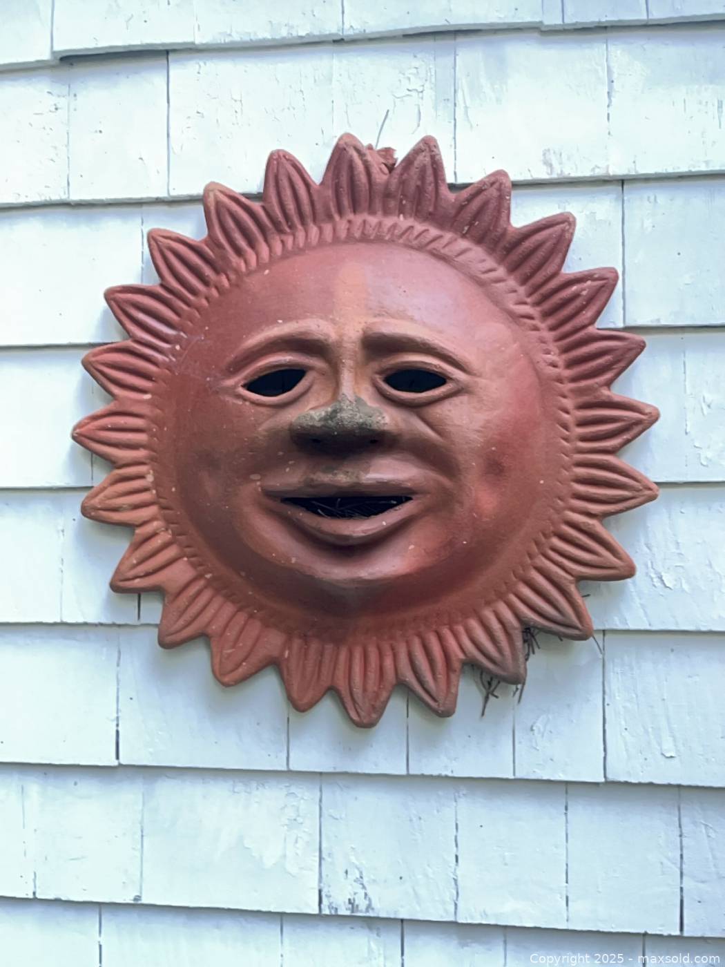 Terracotta sun face wall plaque | Maxsold