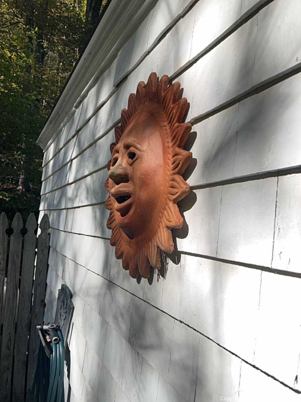 Terracotta sun face wall plaque | Maxsold