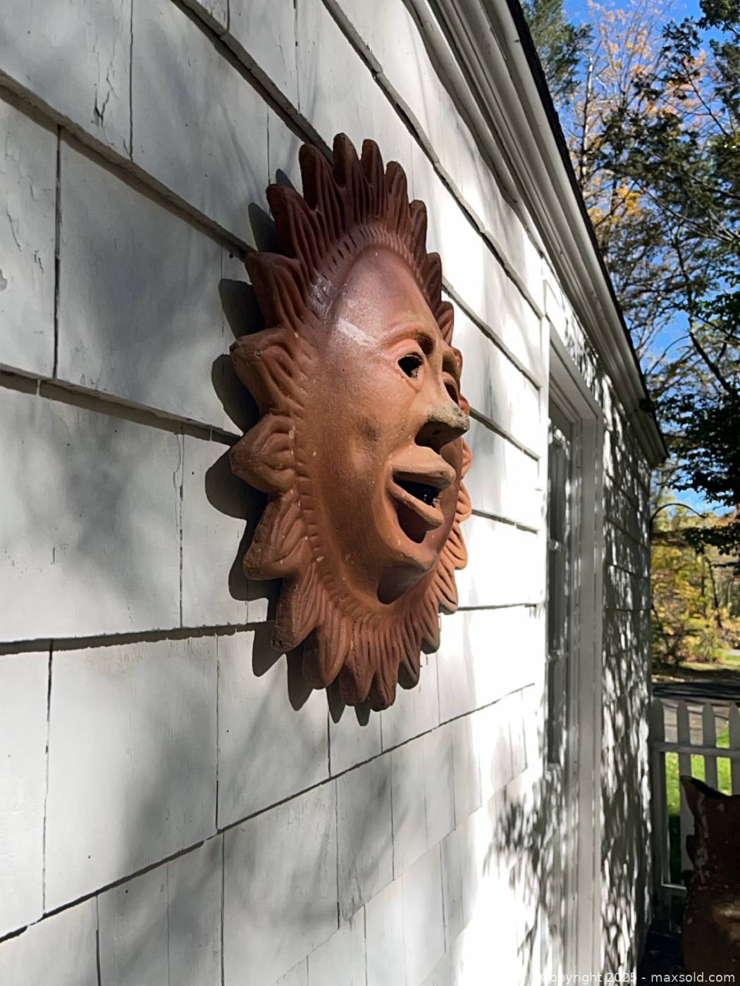 Terracotta sun face wall plaque | Maxsold