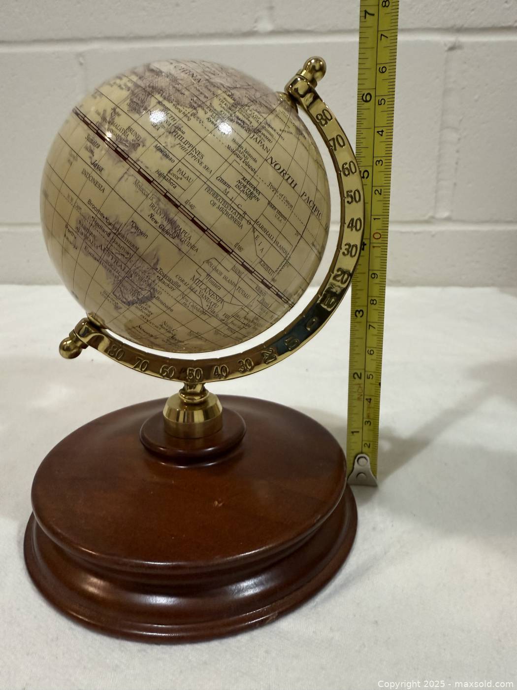 Vintage style tabletop globe on wood base | Maxsold