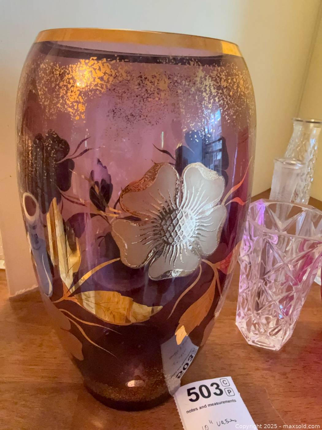 Assorted glass vases, candle holders, unused candles | Maxsold