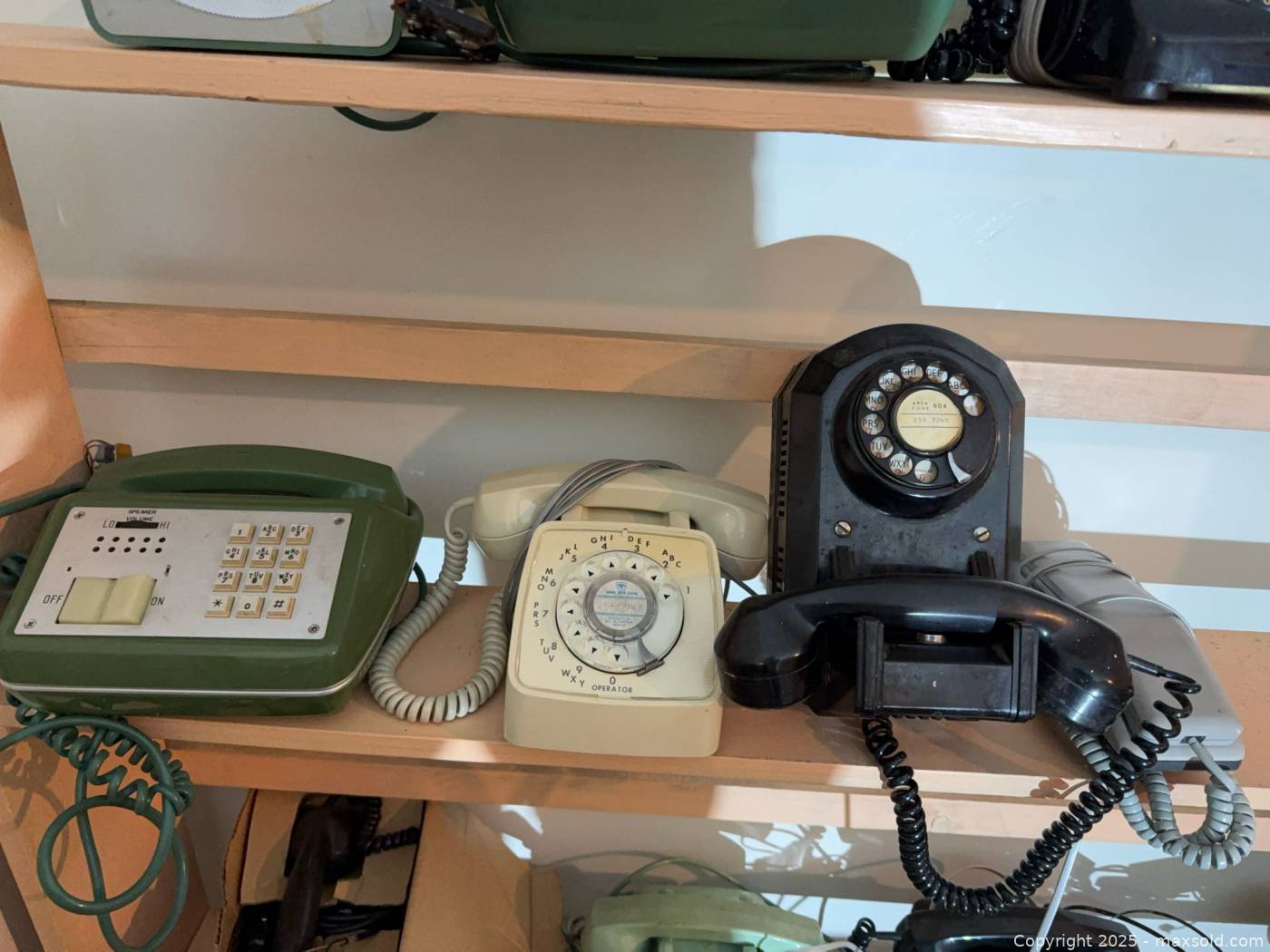 Three vintage rotary and push-button phones | Maxsold