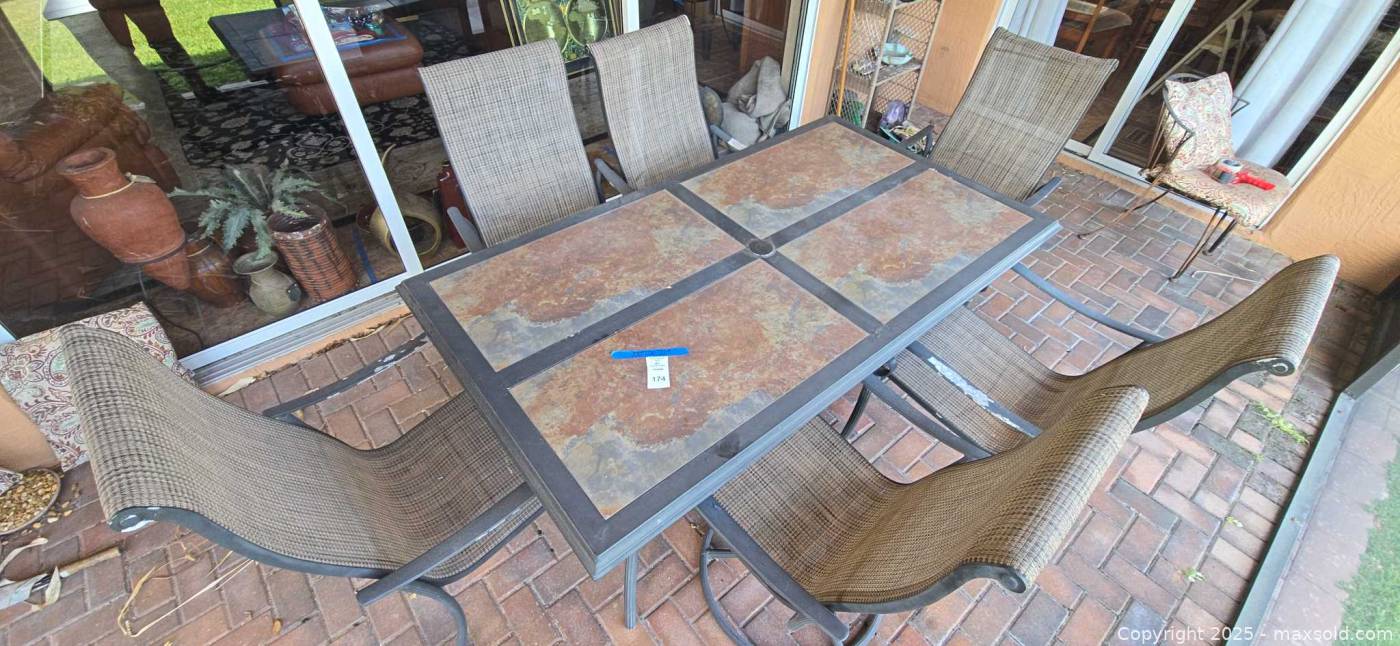 Outdoor 71" rectangular patio dining table and six sling chairs | Maxsold