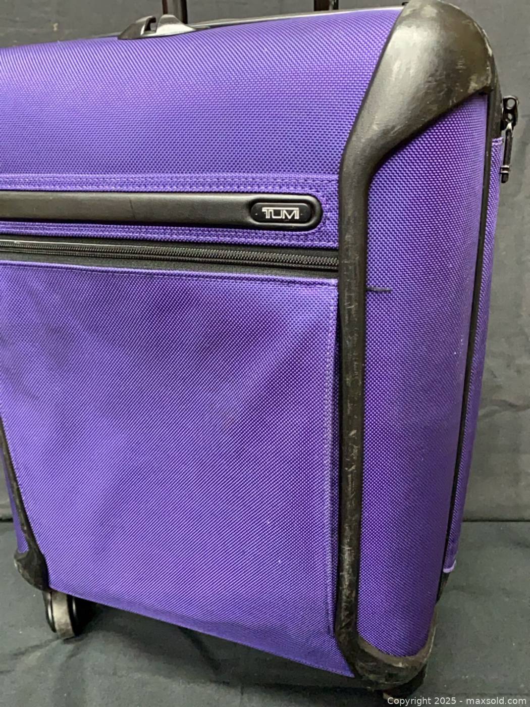 Purple Tumi wheeled carry-on luggage | Maxsold