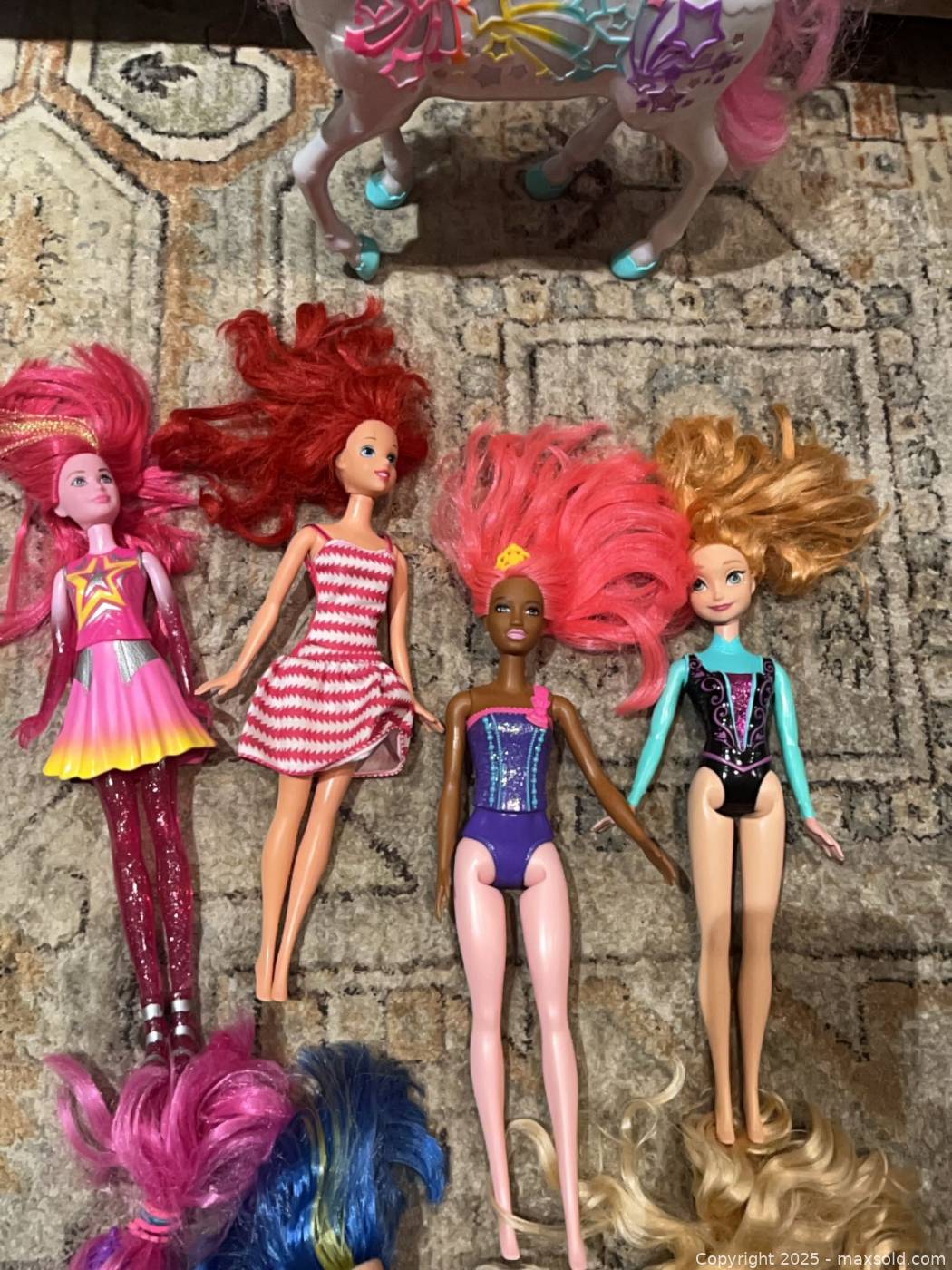 Barbie dolls and unicorn | Maxsold