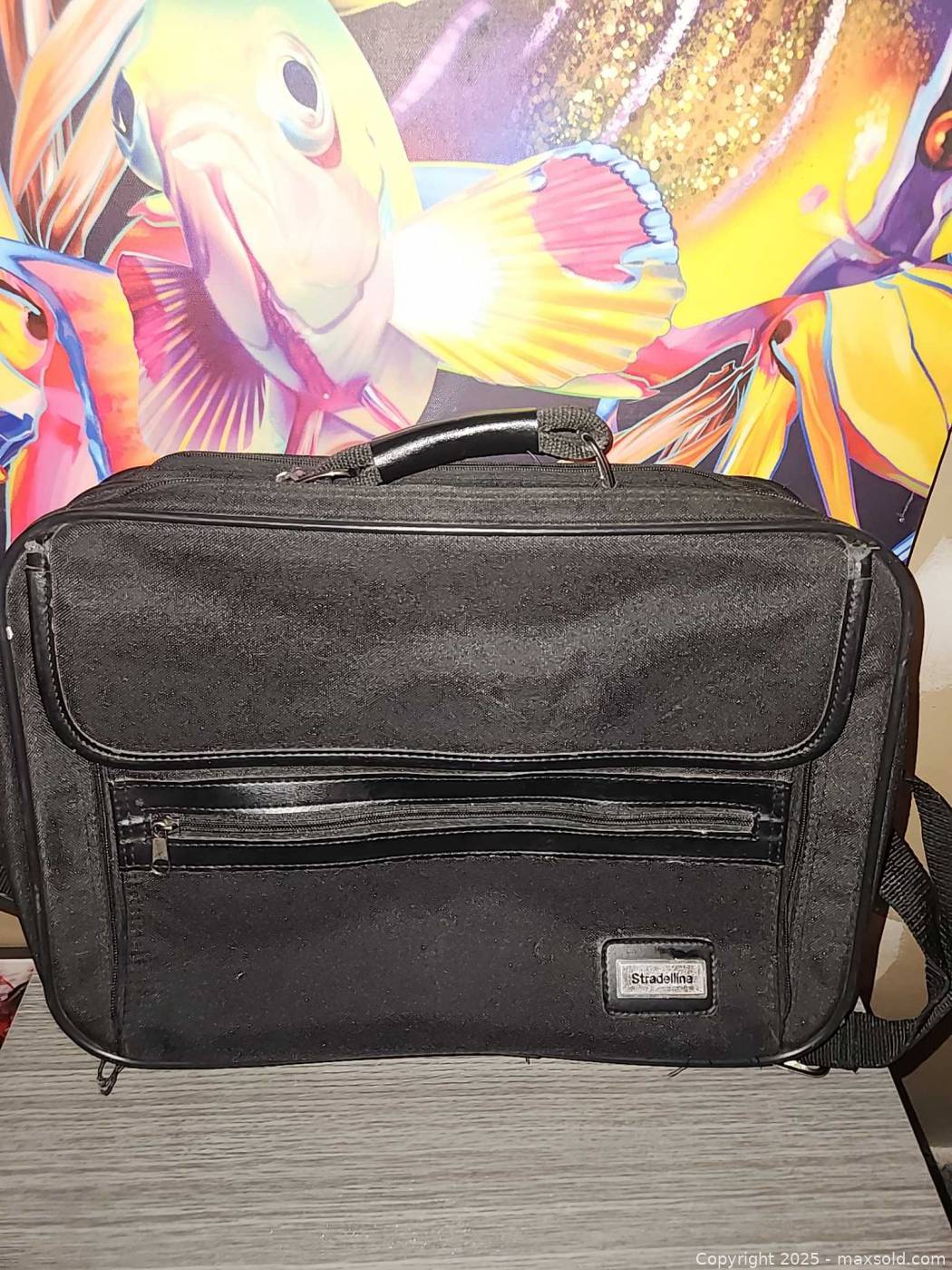 Three black laptop briefcases | Maxsold