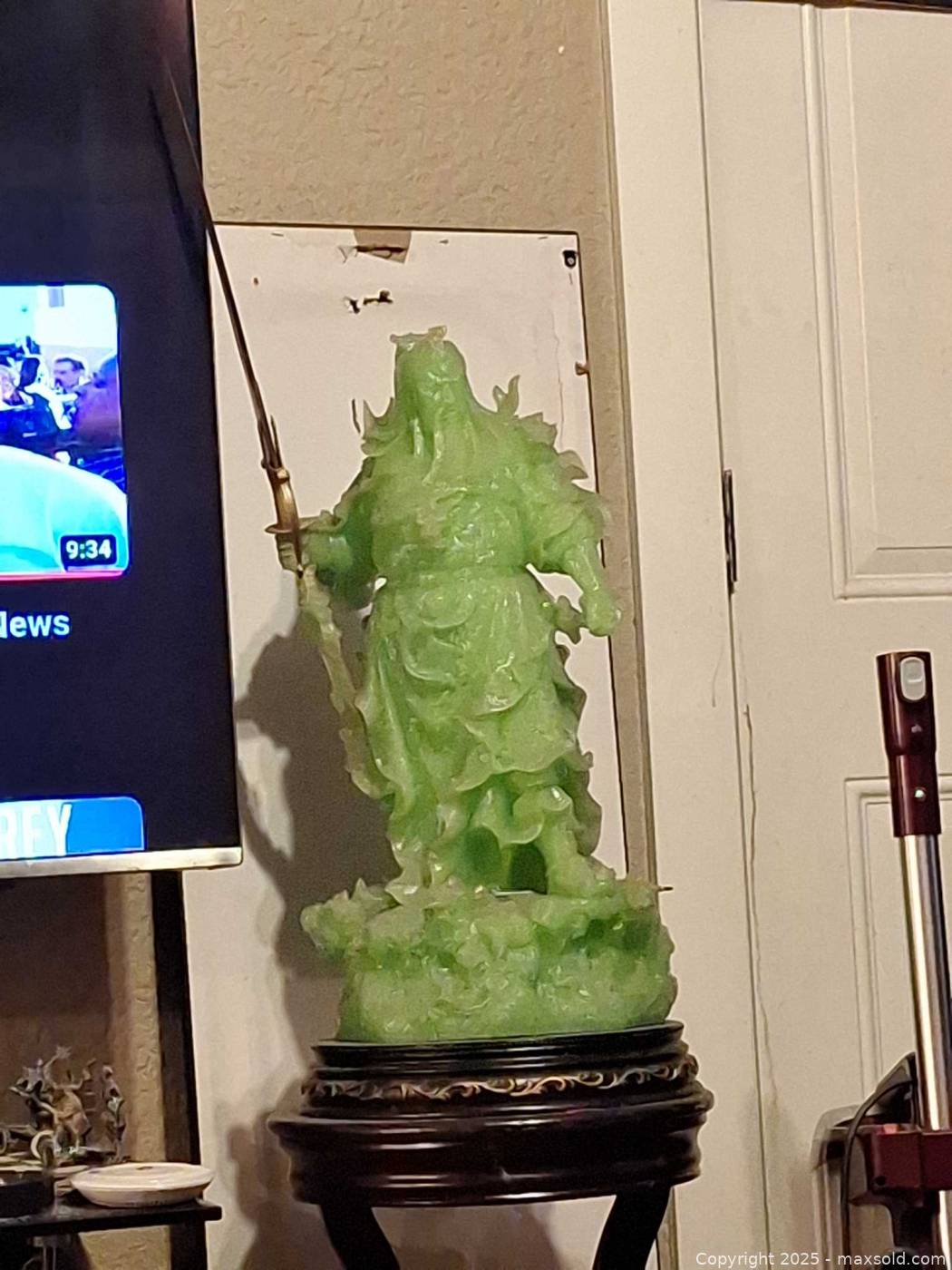 Green translucent warrior statue with stand | Maxsold