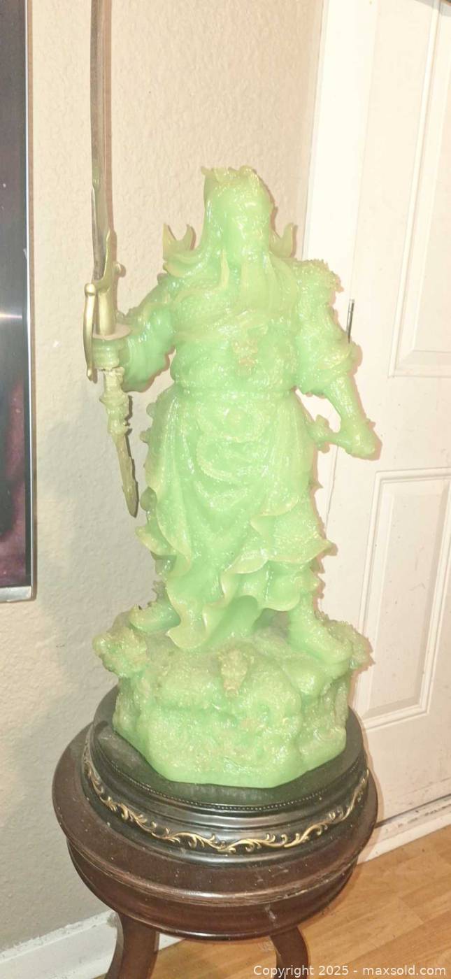 Green translucent warrior statue with stand | Maxsold