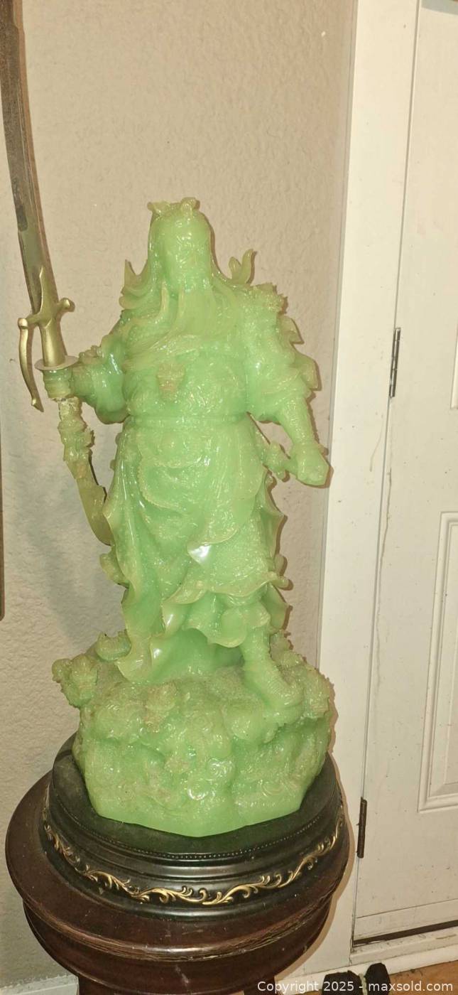 Green translucent warrior statue with stand | Maxsold