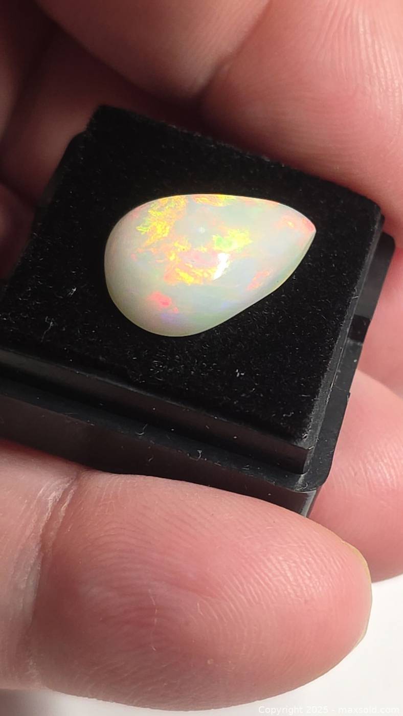 Natural untreated white opal pear cabochon 6.25ct | Maxsold