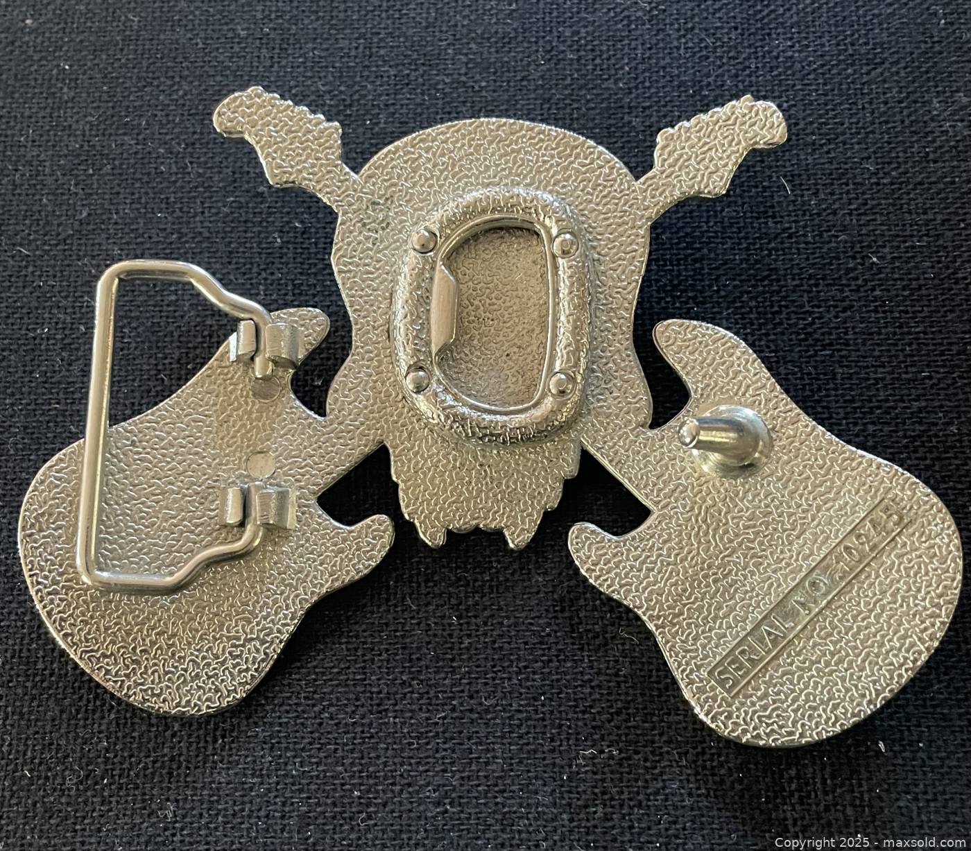Four cast metal novelty belt buckles | Maxsold