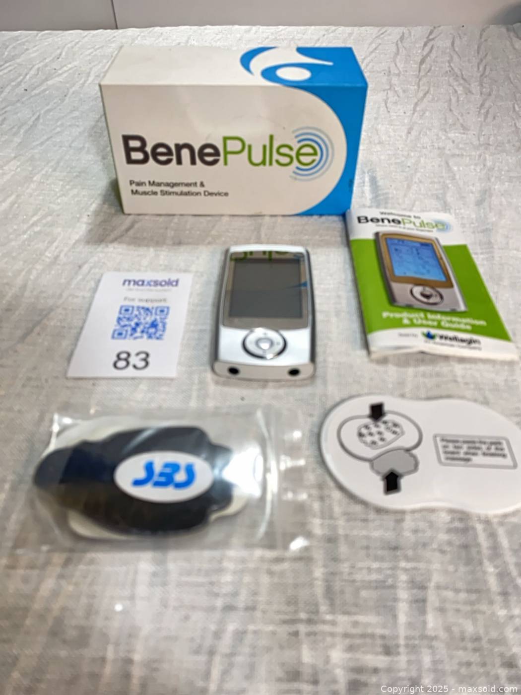 BenePulse rechargeable pain & muscle stimulation device with accessories | Maxsold
