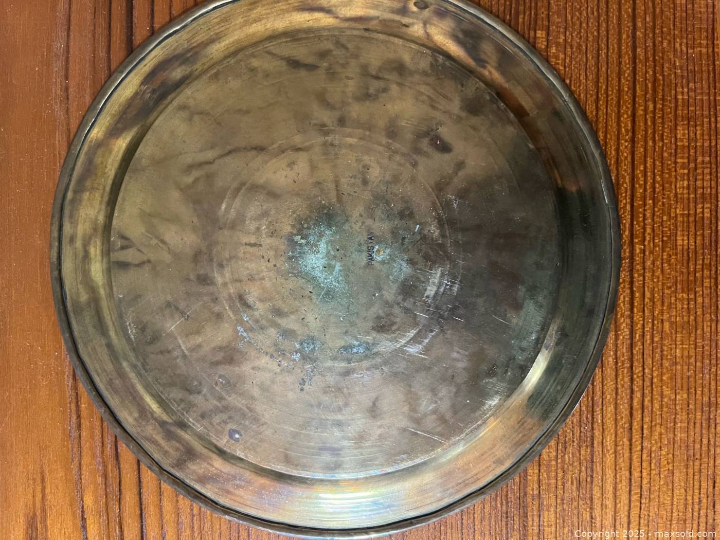 Decorative metal plate and two pottery vessels | Maxsold