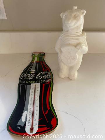 Coca-Cola plastic bottles and bottle thermometer | Maxsold