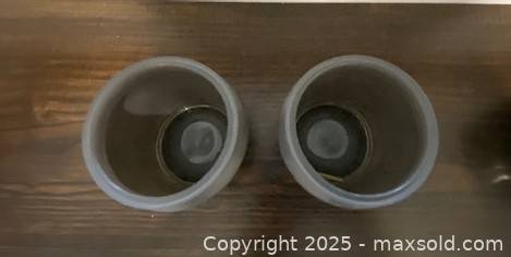 Pair of grey jars with wood lids | Maxsold