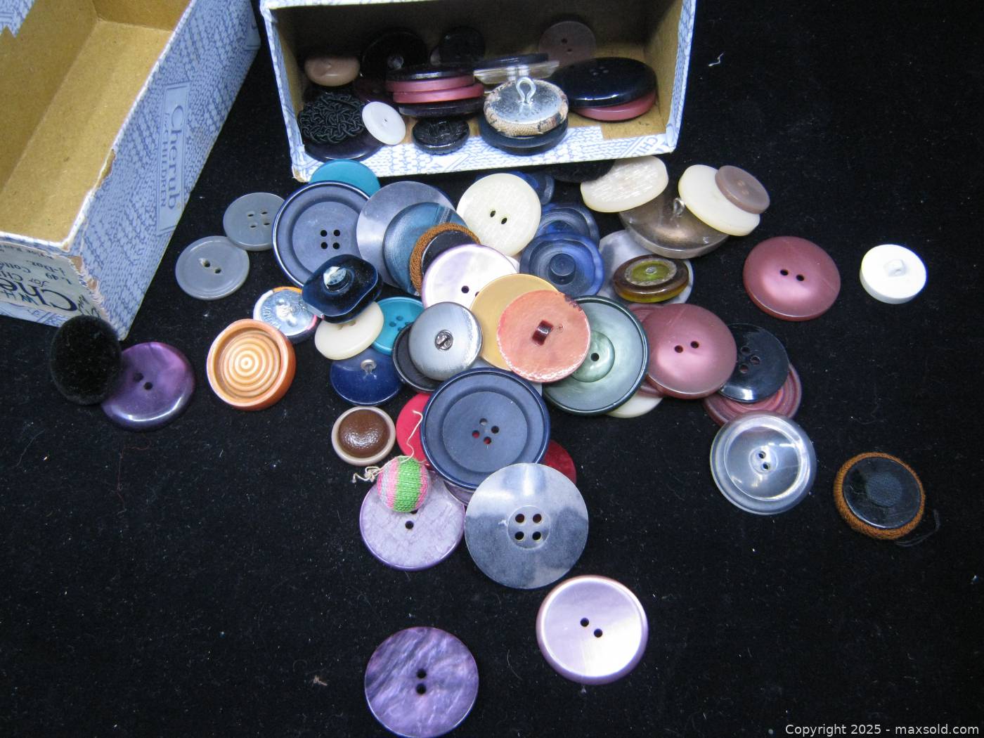 Assorted vintage buttons in small box | Maxsold