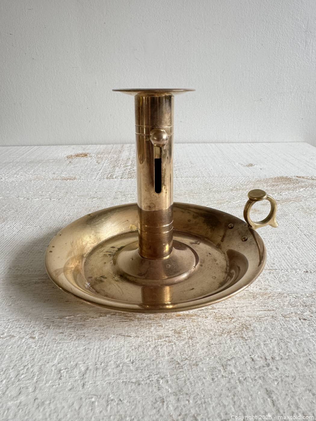 Brass push-up chamberstick candle holder | Maxsold