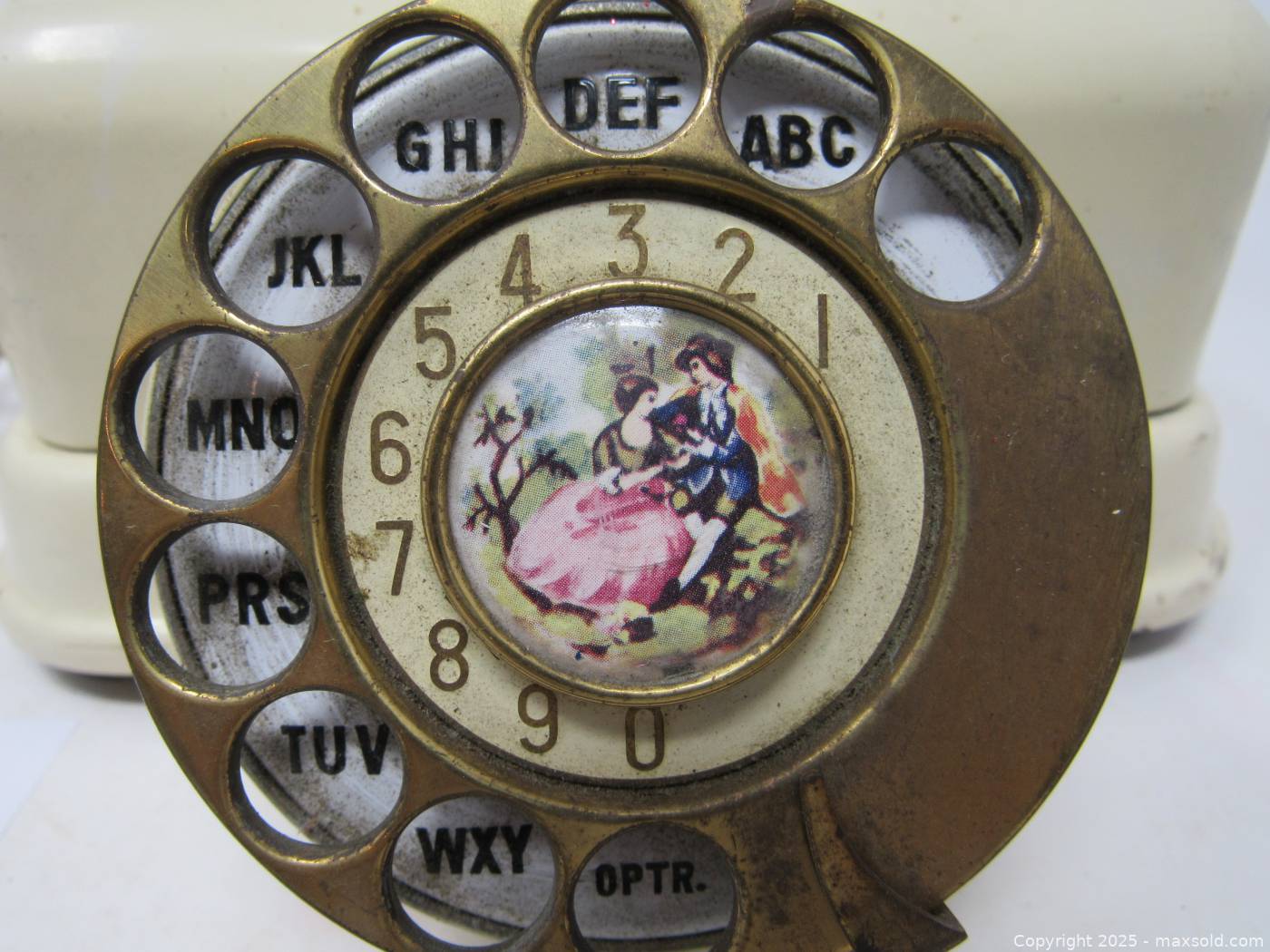 Antique cream rotary dial telephone | Maxsold