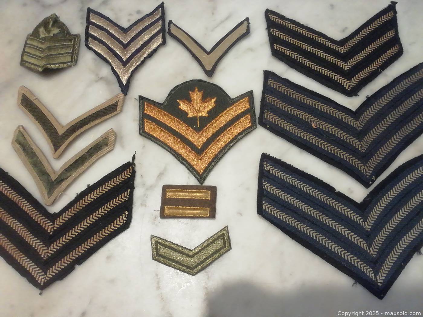 Twelve embroidered military NCO rank patches | Maxsold