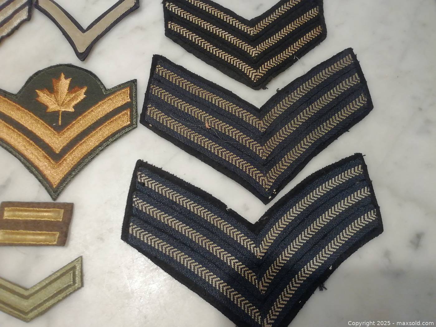 Twelve embroidered military NCO rank patches | Maxsold