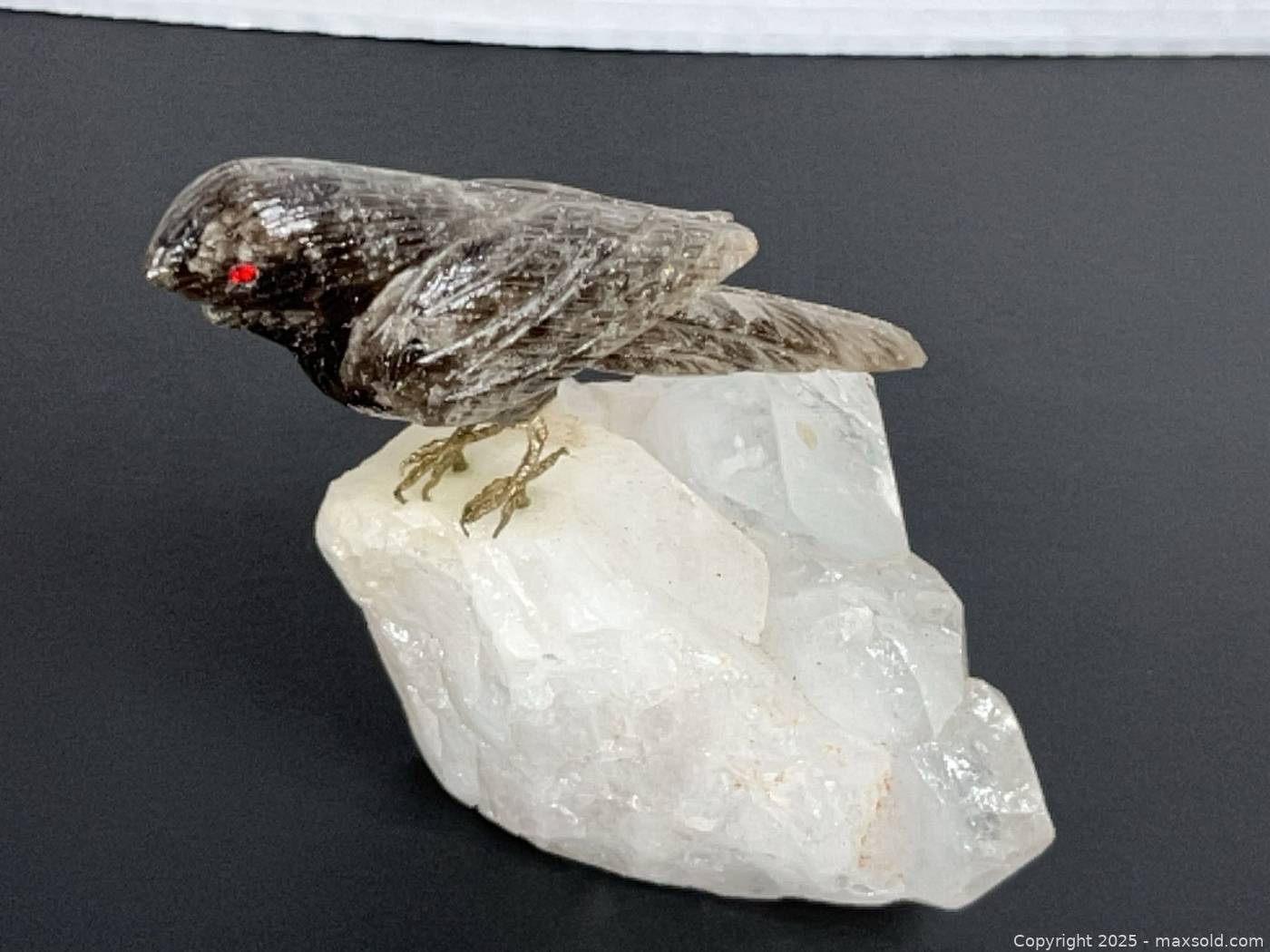 Carved gemstone bird figurine on quartz crystal base | Maxsold