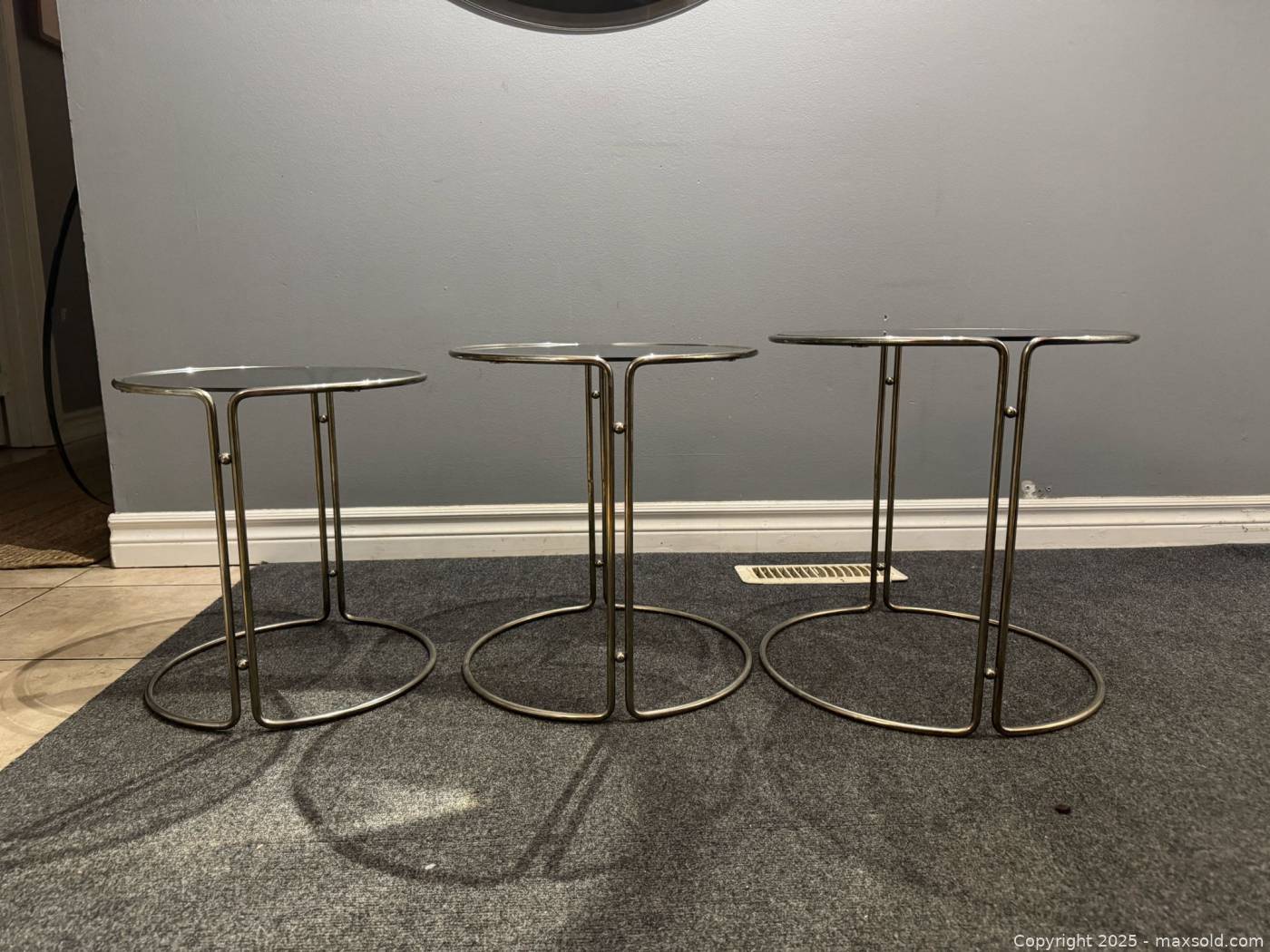 Steel and glass stacking side tables set | Maxsold