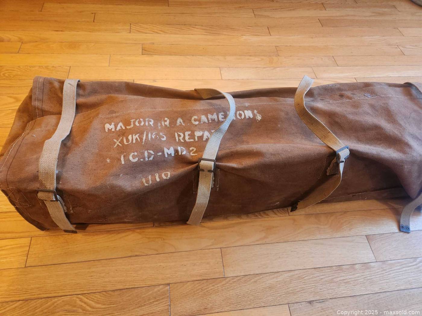 Two wooden military folding cots with canvas bag | Maxsold