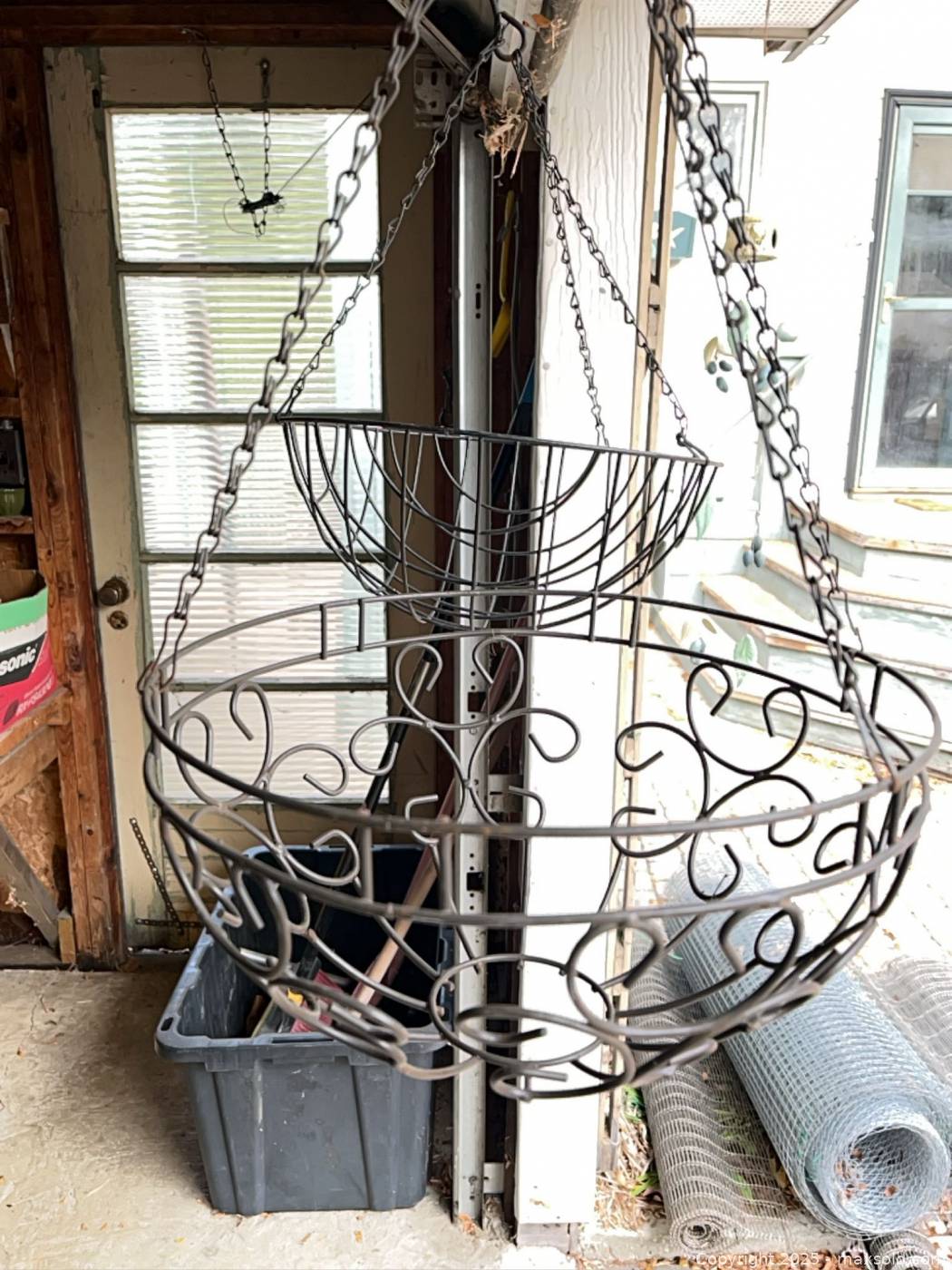 Three metal hanging planter baskets with chains | Maxsold