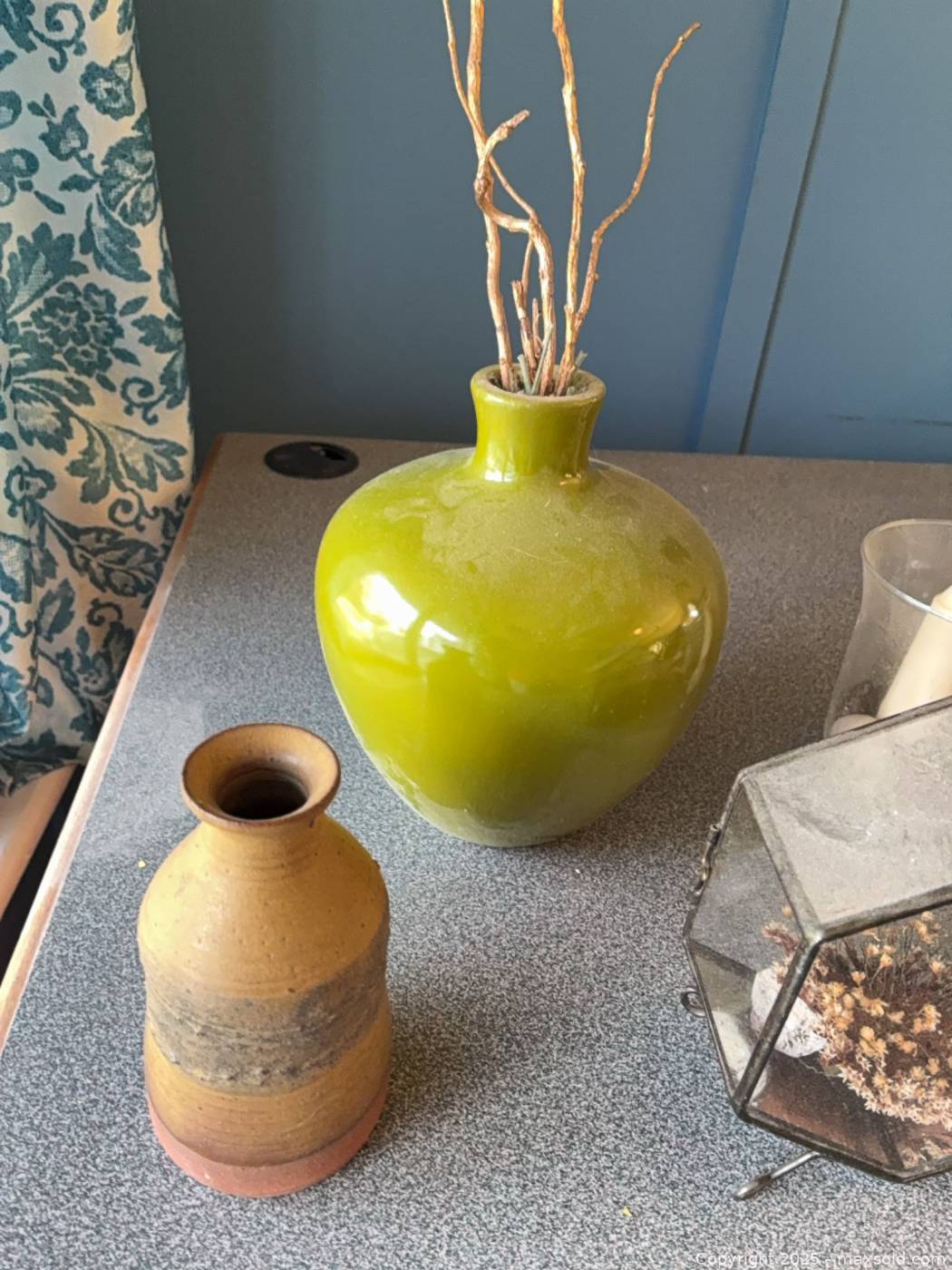 Assorted decor: green ceramic vase, pottery bud vase, glass terrarium ...