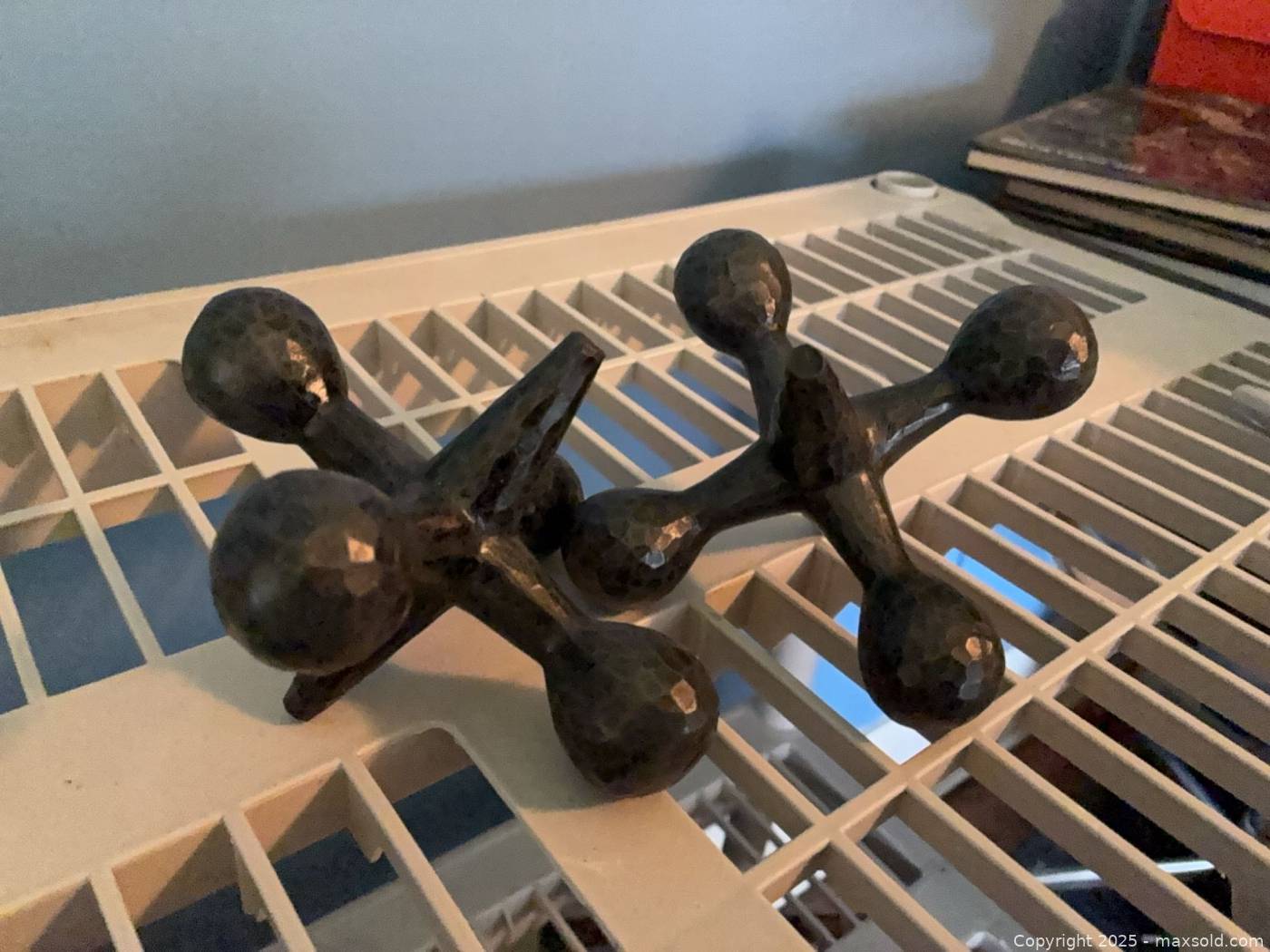 Pair of Metal Jack Sculptures | Maxsold