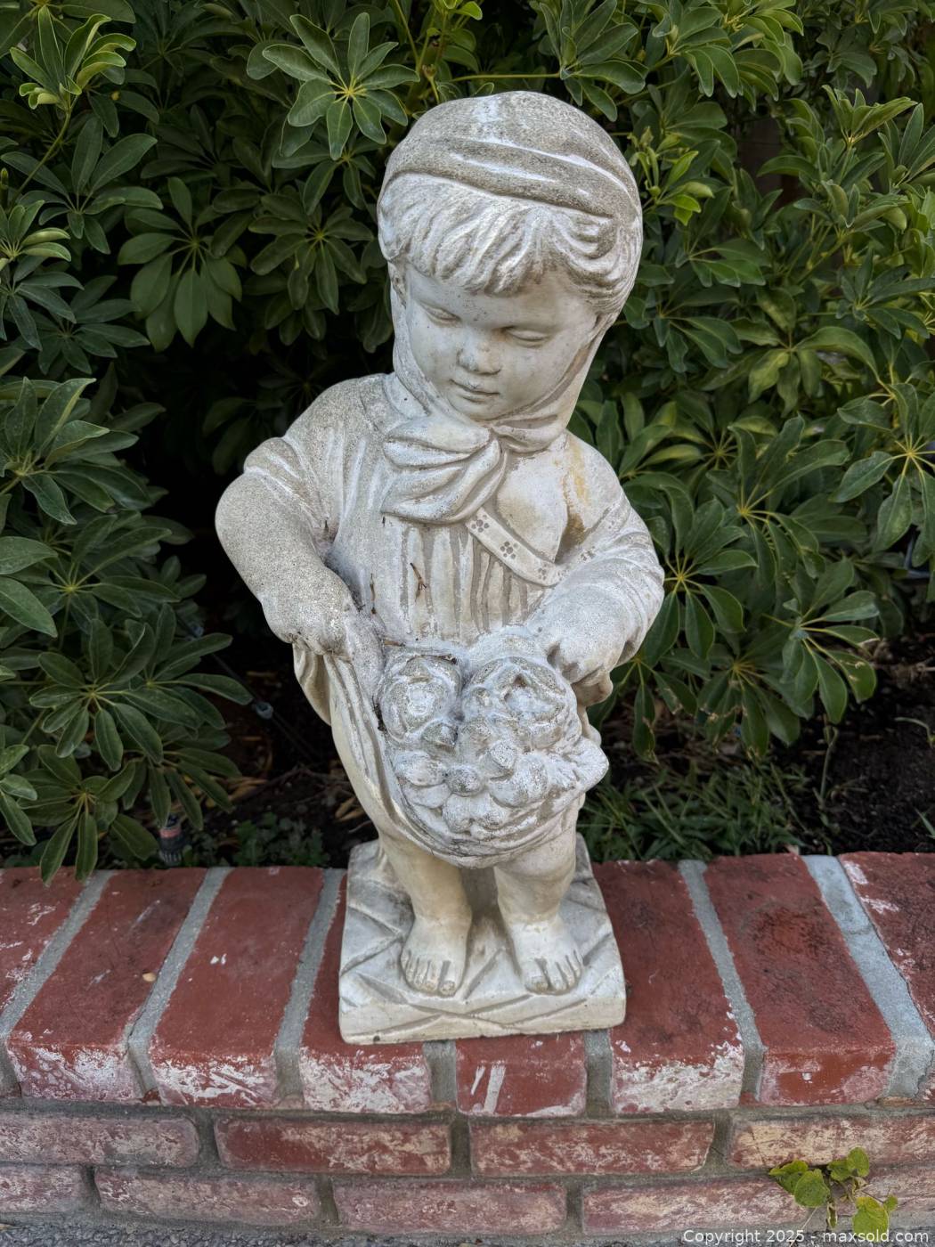 Vintage concrete boy statue | Maxsold
