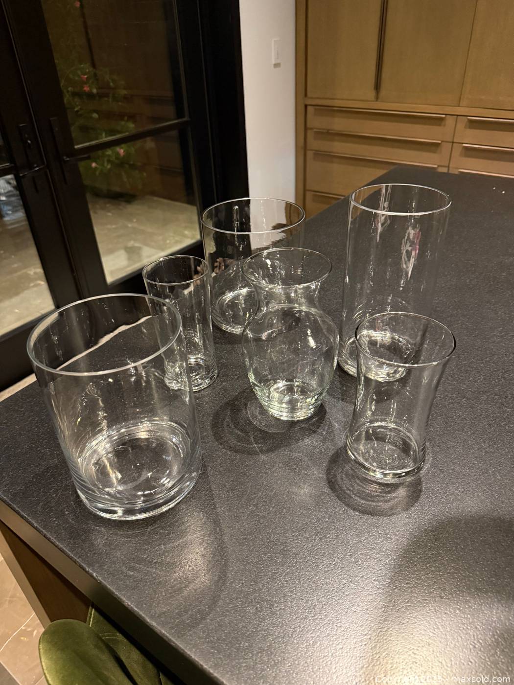 Six clear glass vases assorted shapes | Maxsold