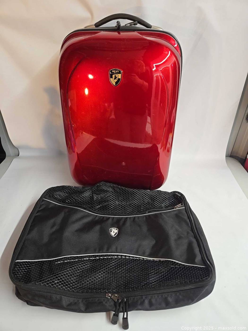 Heys metallic red hardside carry-on suitcase | Maxsold